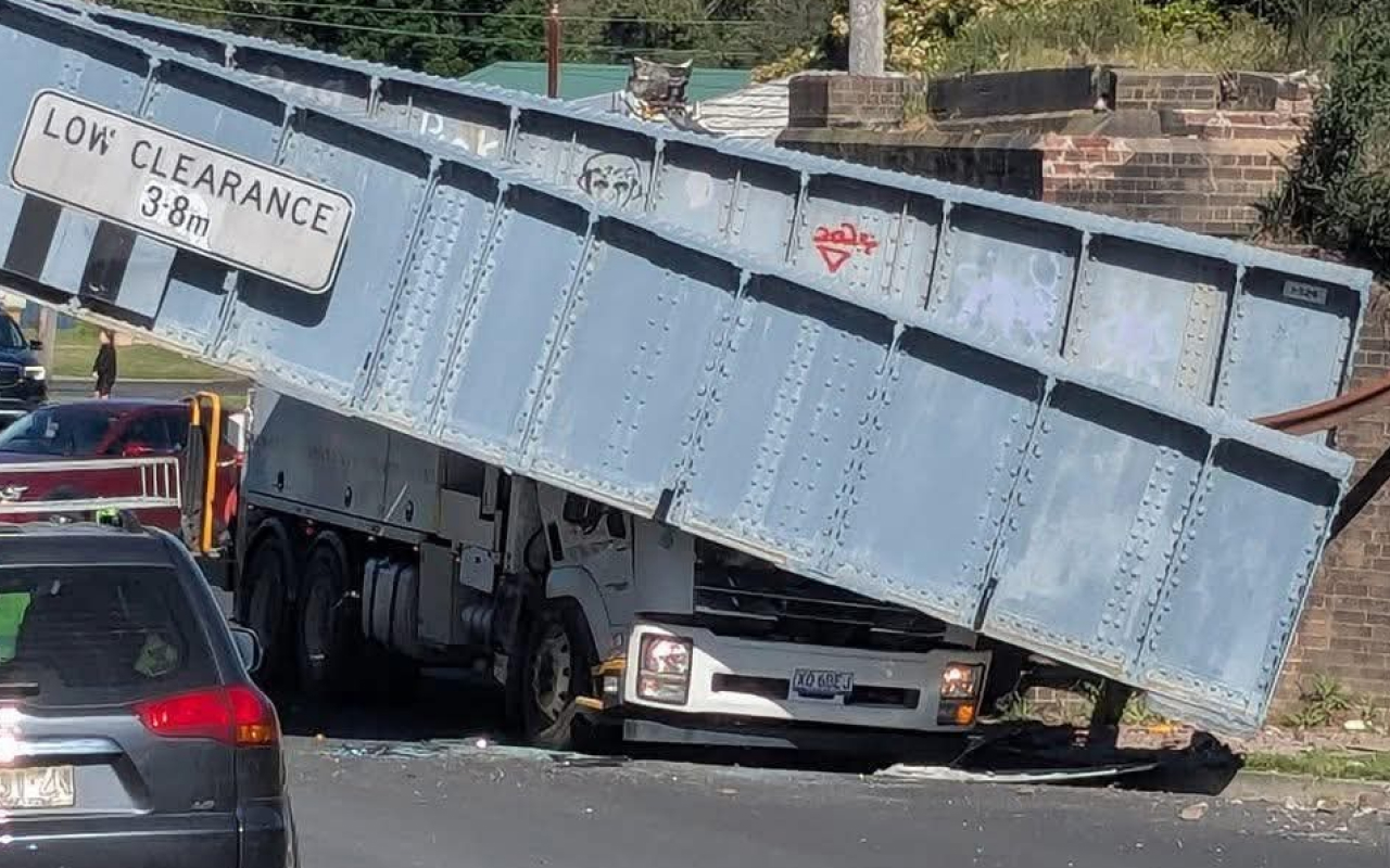 Passenger dead after truck crashes into rail bridge