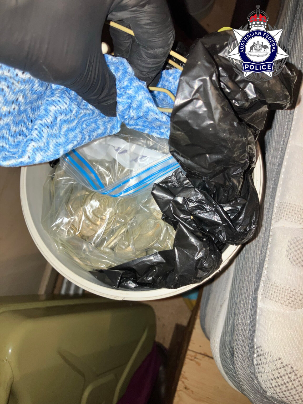 Buckets of gold seized in raids on NDIS fraud syndicate